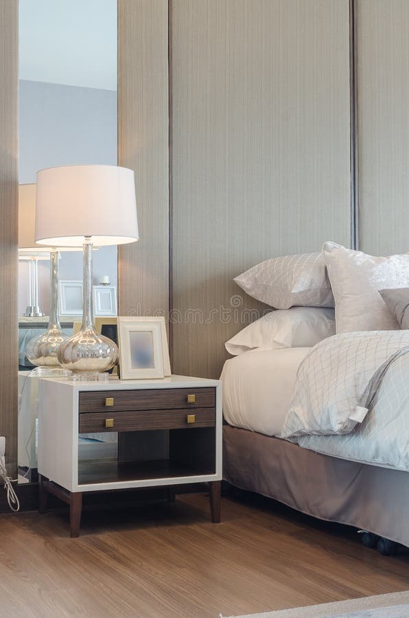 White Classic Lamp with Glass Vase of Flower on Table Side Stock Image ...