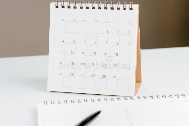 White Clean Desktop Calendar on Desk with Pen and Note Pad Using As ...