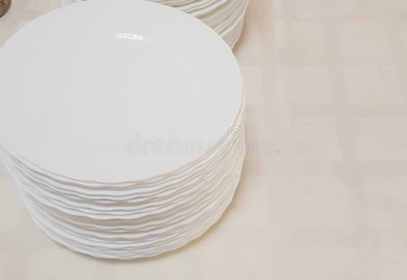 White Clean Empty Plates in a Stack on the Table, Service in the Hotel ...