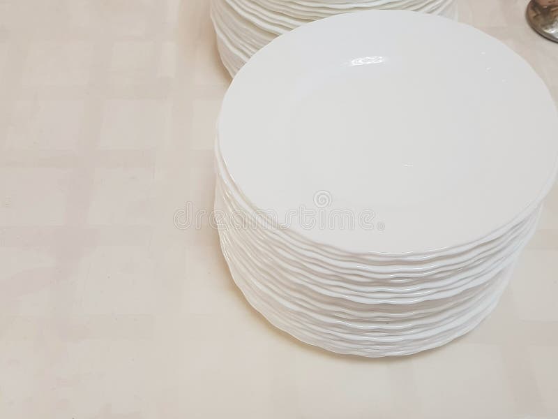White Clean Empty Plates in a Stack on the Table, Service in the Hotel ...