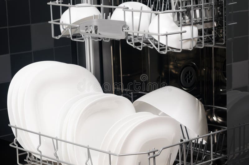 White Clean Plates in the Dishwasher, Background, Side View Stock Image ...