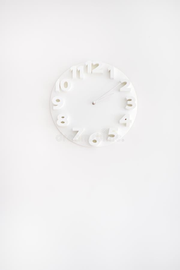 White clock on white wall stock photo. Image of elements - 138120890