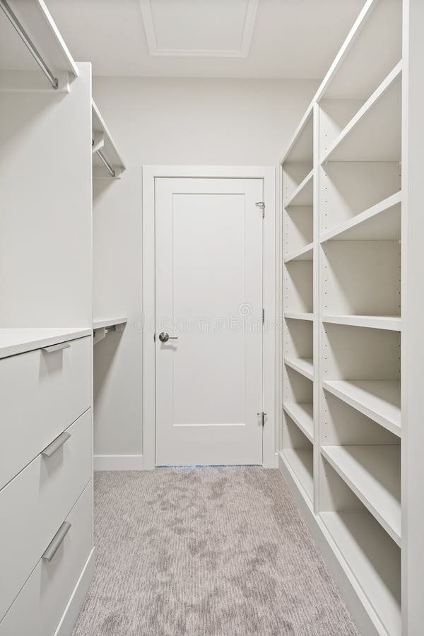 A White Closet with a Door and Shelves Stock Image - Image of open ...