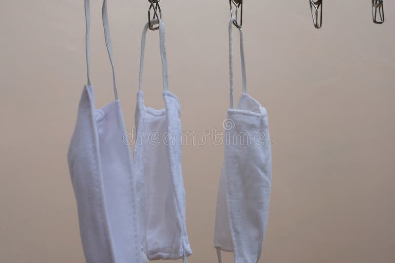 White Cloth Face Mask To Wash and Dry it for Reuse Stock Photo - Image ...