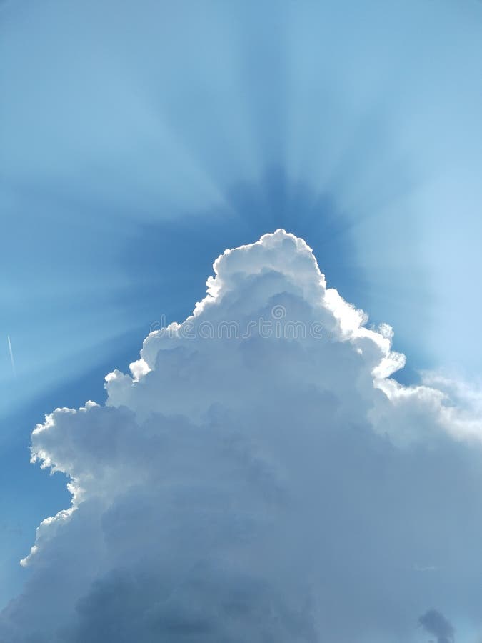 White Cloud on Blue Sky. Cloudscape in Blue Sky. Sun Behind a Cloud ...