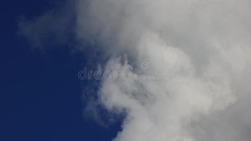 White Cloud Moves Quickly and Changes Shape Against the Blue Sky. Cloud ...