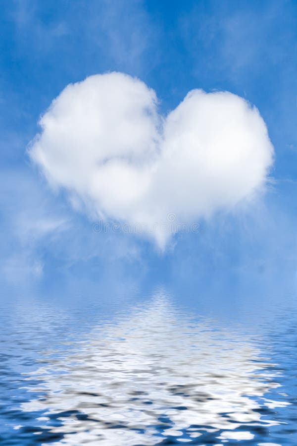 A White Cloud in the Shape of a Heart on a Blue Sky and with a ...