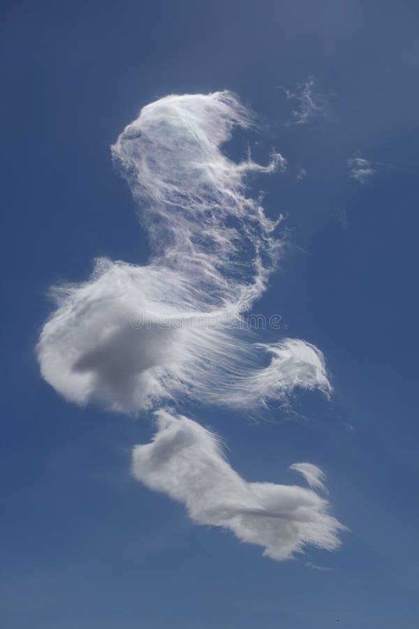 White Cloud with Strange Shape Spread Over Blue Sky on Windy Day Stock ...