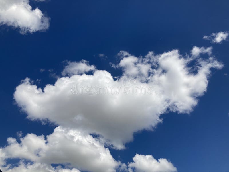 White Clouds Spread in the Intense Blue Sky Stock Photo - Image of ...