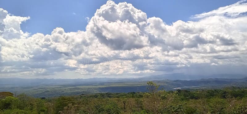White Clouds Provide Freshness Amidst the Blue Sky and Green Mountains ...