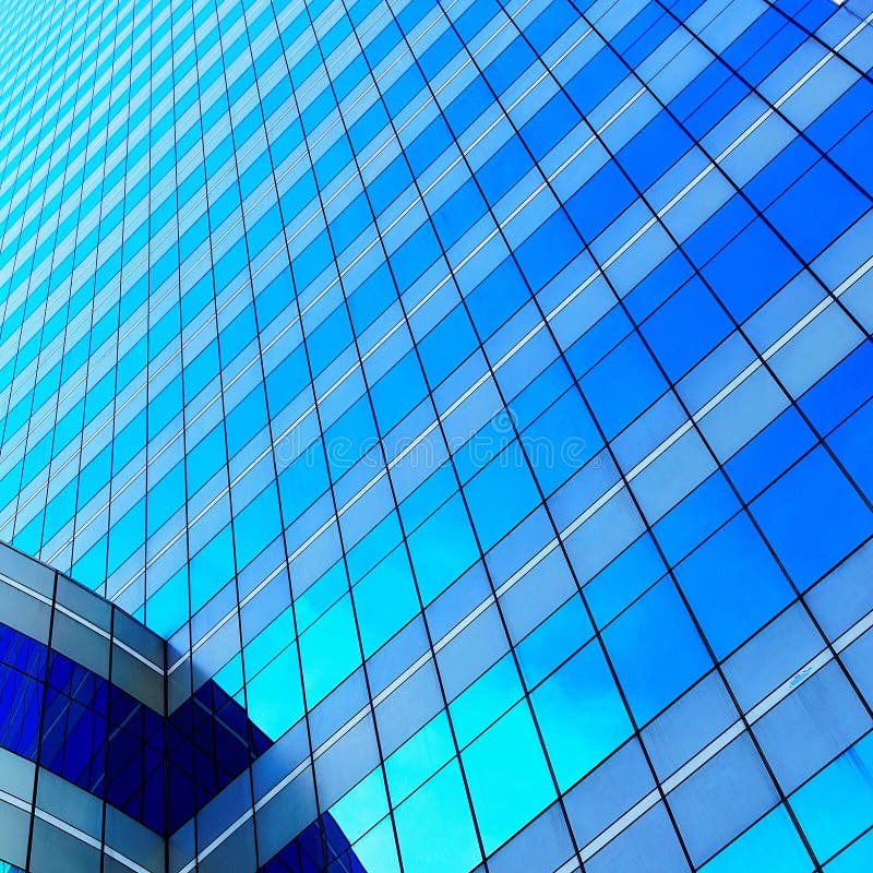 White Clouds Reflect Sunlight on Tall Glass Blue Abstract Crop of ...
