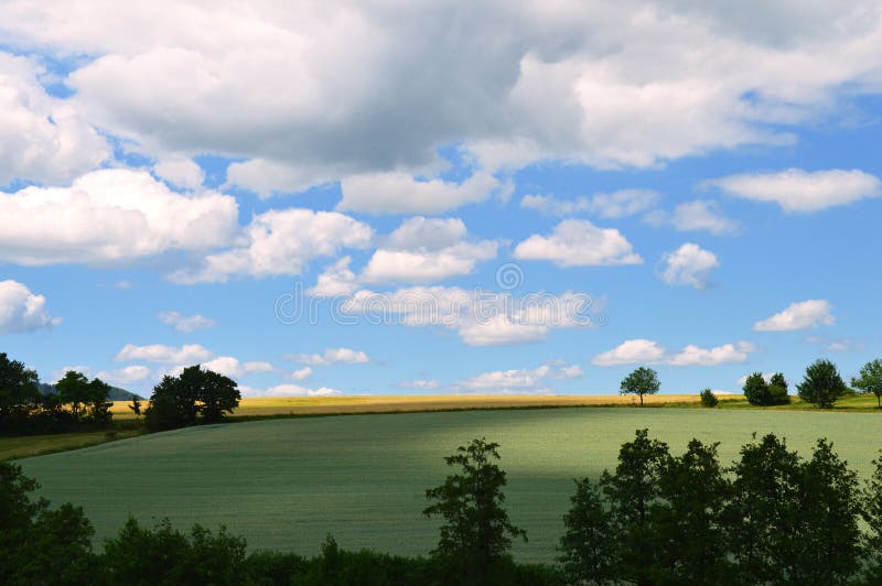White Clouds Shadowing Meadow Stock Photo - Image of agricultural ...