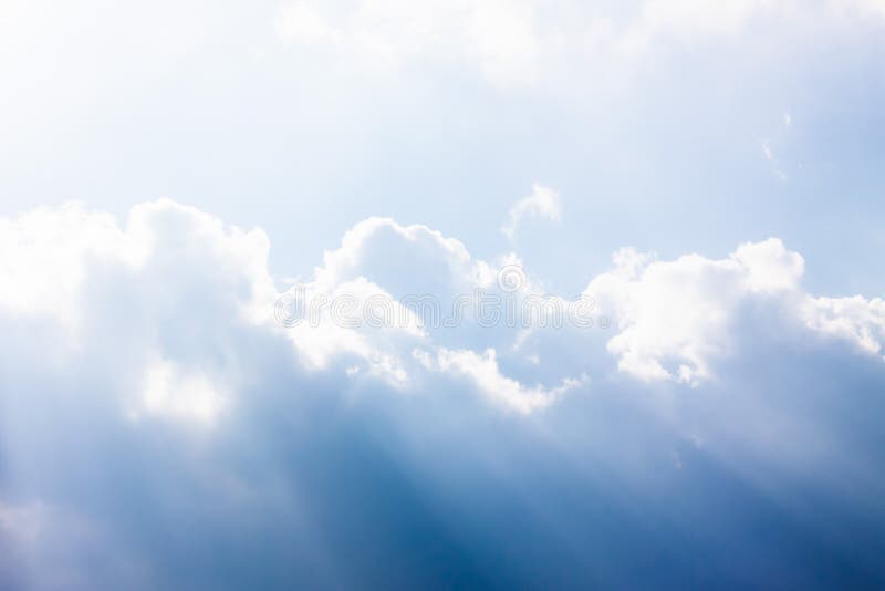 White Clouds with Sunlight Streaming through Them Stock Photo - Image ...