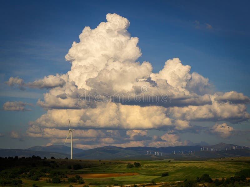 White Clouds, Windmill and Field Stock Photo - Image of heaven, field ...