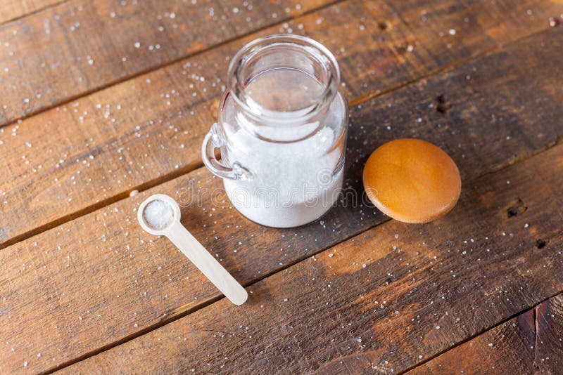 White Coarse Ground Salt on Wooden Table Background with Serving Stock ...