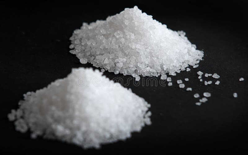 White Coarse Sea Salt on a Black Background Stock Image - Image of ...