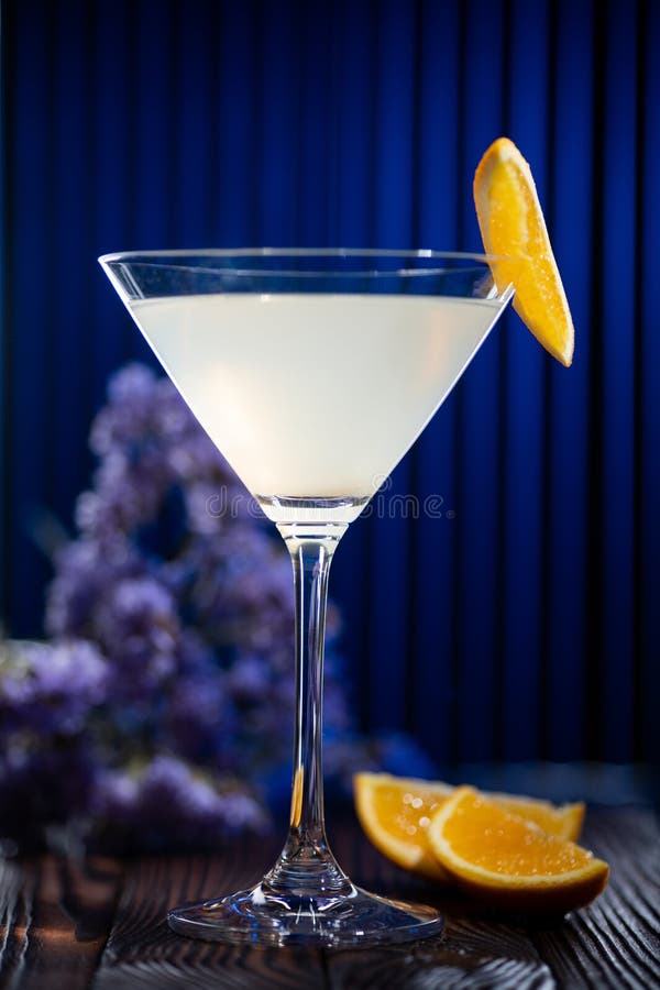 White Cocktail with Orange Slice. Still Life in a Low Key Stock Photo ...