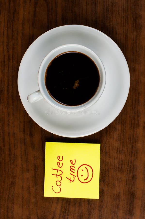 White Coffee Cup and Coffee Beans on a Wooden Table.Coffee Time Stock ...