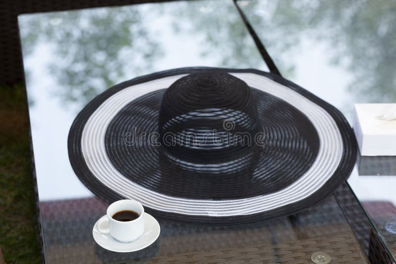 White Coffee Cup with Hat on Glass Table Summer Vacation Concept, Stock ...