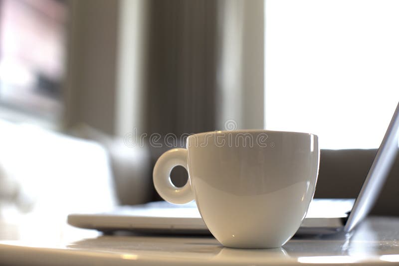 White Coffee Mug beside Laptop Computer Stock Photo - Image of online ...