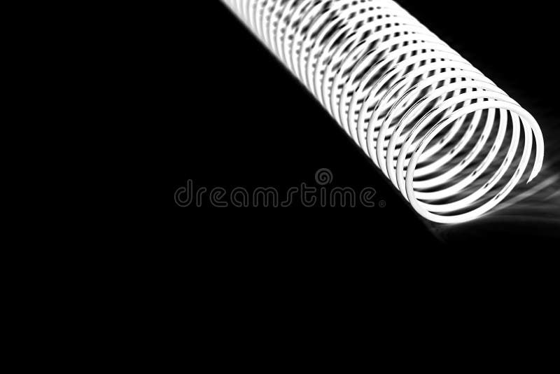 White coil spring on black stock image. Image of artistic - 231407051