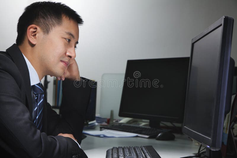 White-collar Worker Sitting in Front of Computer in Office Stock Photo ...