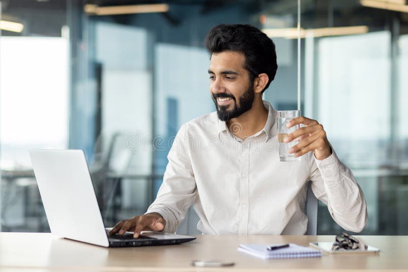 White-collar Worker Using Laptop on Desk with Water Stock Image - Image ...