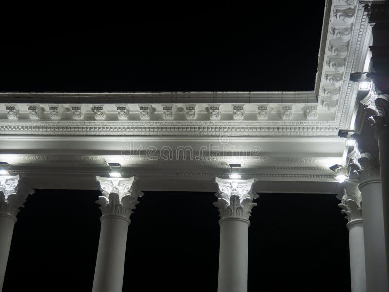 White Colonnade in the Dark. White Columns in the Light of Spotlights ...