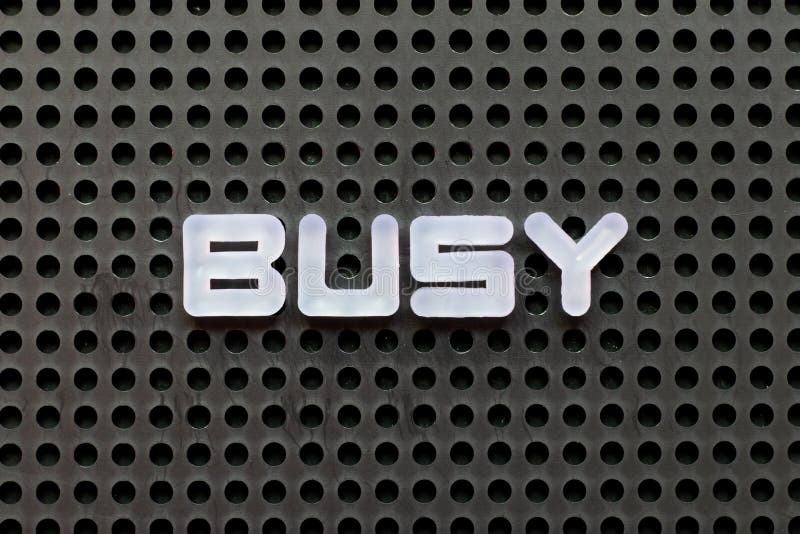 White Letter in Word Busy on Black Pegboard Background Stock Image ...