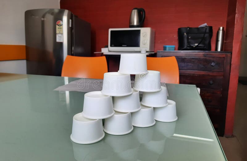 White Color Paper Coffee Cup Tower or Pyramid in the Table Stock Image ...
