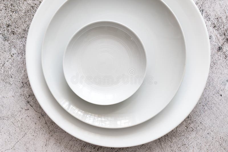 White Color Plain Dinner Plate on Stone Table Top View Stock Image ...