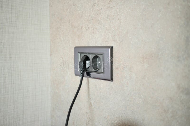 White Color Power Cord Cable Plugged into Wall Stock Image - Image of ...