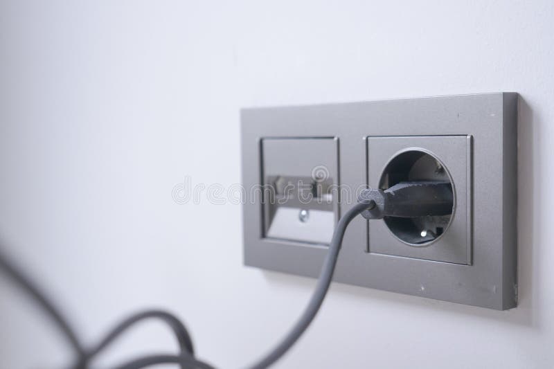 White Color Power Cord Cable Plugged into Wall Stock Photo - Image of ...