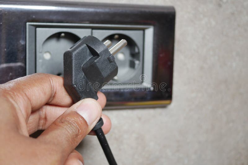 White Color Power Cord Cable Plugged into Wall Stock Photo - Image of ...