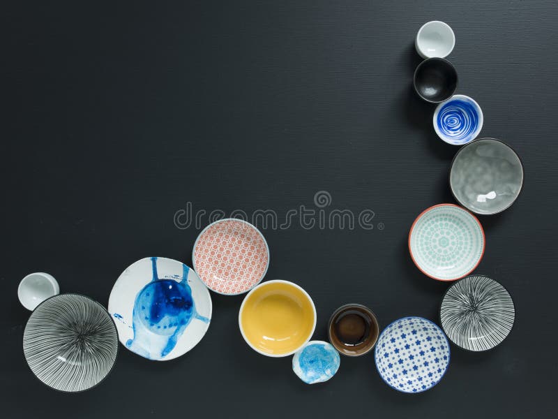 White and Colorful Tableware in Different Designs and Sizes on Black ...