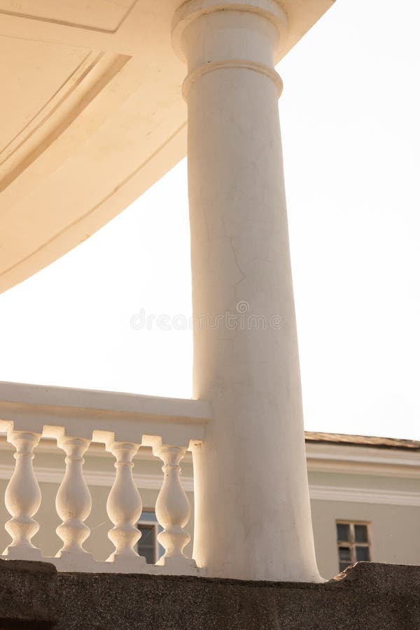 A White Column with a Balcony Railing on Either Side Stock Image ...
