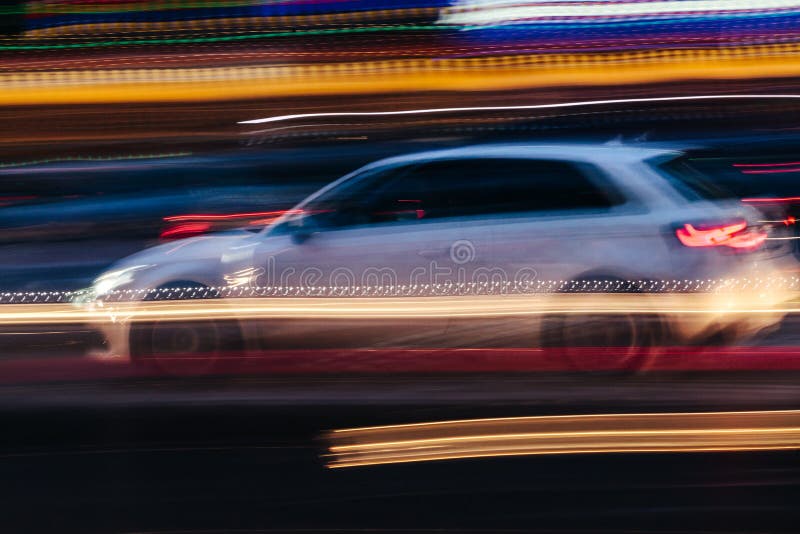 White Compact Car in a Blurred City Scene Stock Image - Image of speed ...
