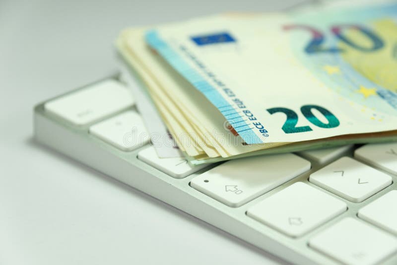 A computer and euro bills stock image. Image of laptop - 137380021