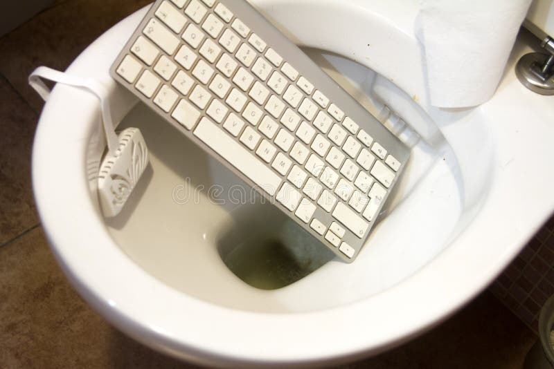 White Computer Keyboard that is Thrown into the Toilet with Water Stock ...