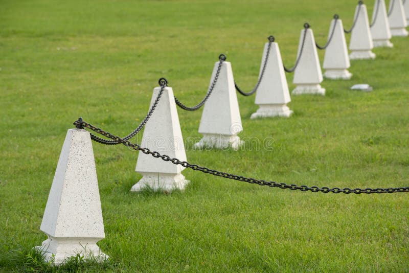 White Concrete Pillars With Black Chain. Fencing Of The Protected ...
