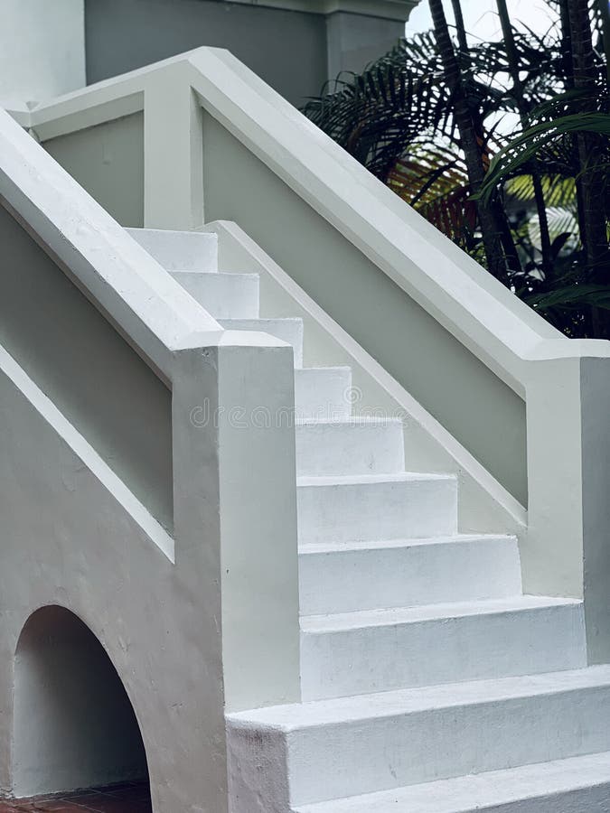 White Concrete Staircase with Rectangular Railings and a Smooth Finish ...