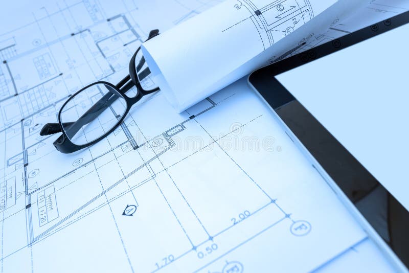 White Construction Design Sheet with Glasses Placed and a Tablet Stock ...