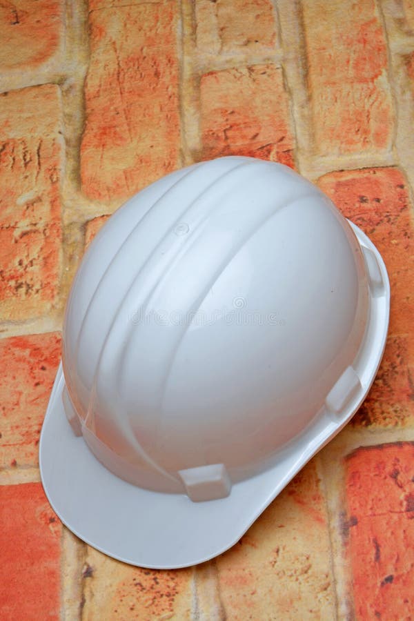 Hart Hat on Wall Background Stock Photo - Image of repairing, danger ...