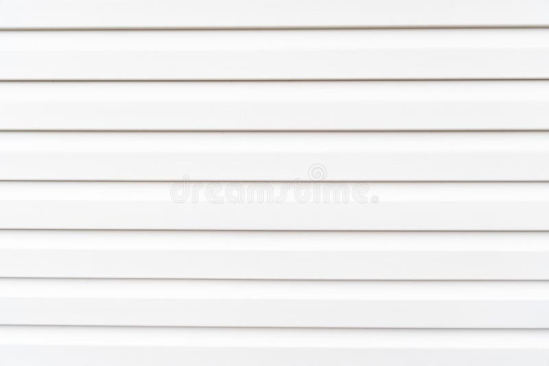 White Construction Vinyl Siding Panels. House Covered with Plastic ...