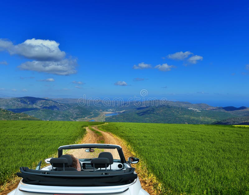 White Convertible on a Country Road through Fields Stock Photo - Image ...