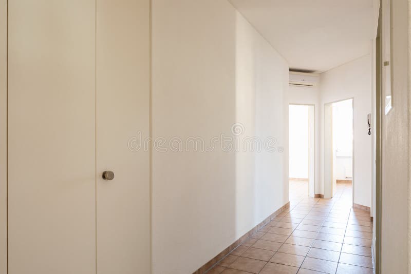 White Corridor with Tiles and Open Doors Stock Photo - Image of doors ...