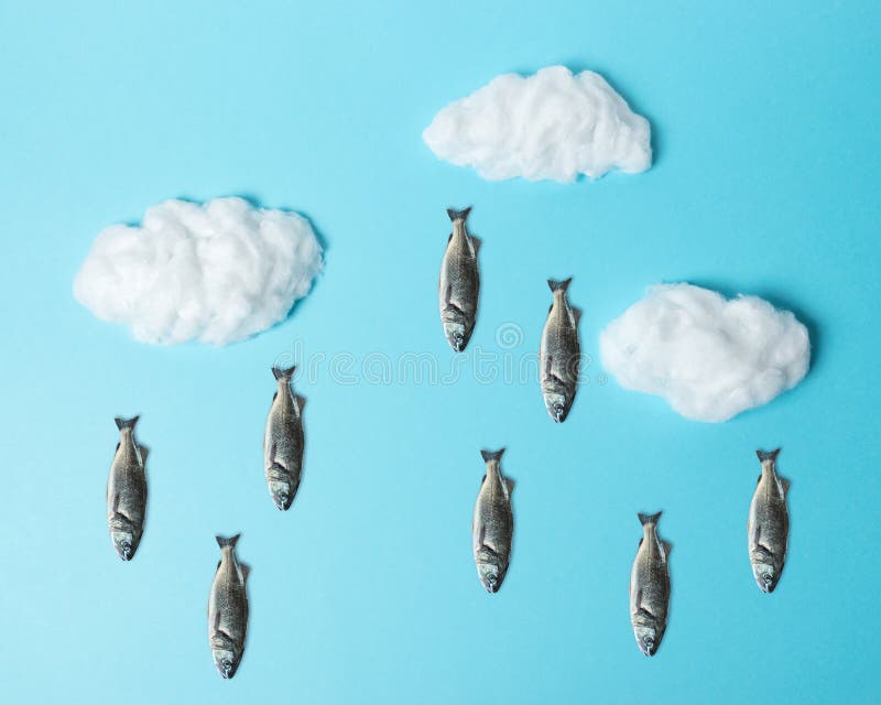 White Cotton Clouds with Fish on Pastel Blue Background. Minimal ...