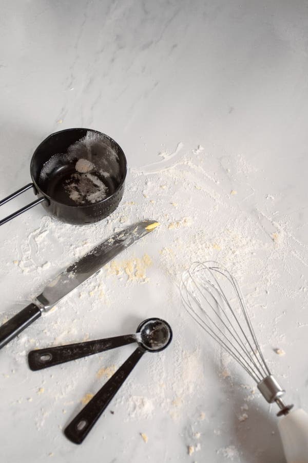 White Countertop Surface with Kitchen Utensils Used for Baking a Cake ...