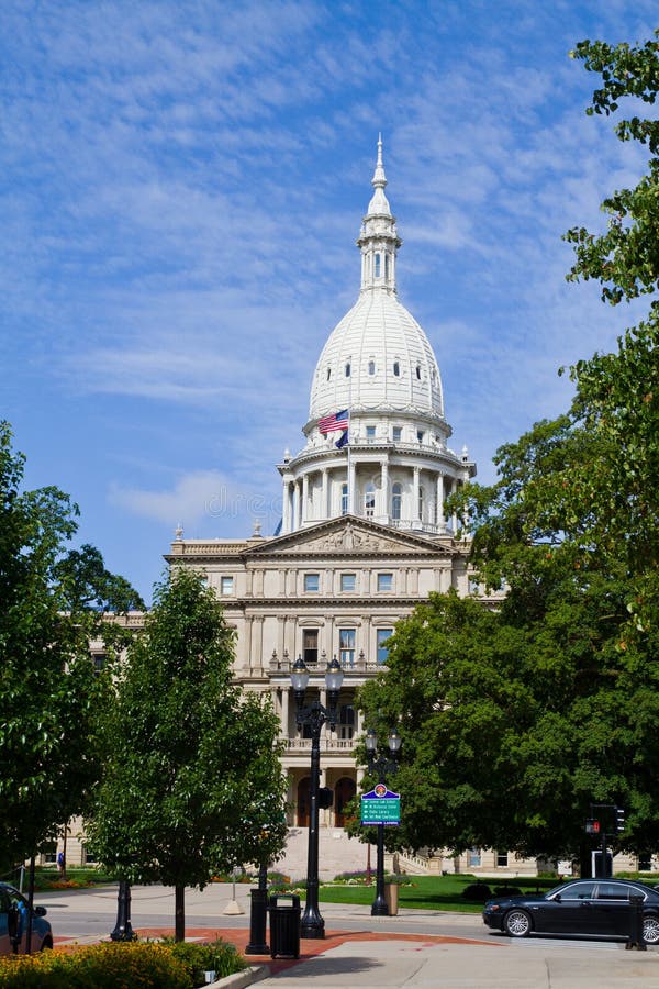 White Courthouse Building in Lansing with Trees and a Car Editorial ...