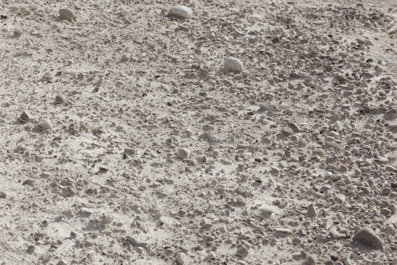 White Cracked Lumpy Soil with Stones from Side Stock Photo - Image of ...